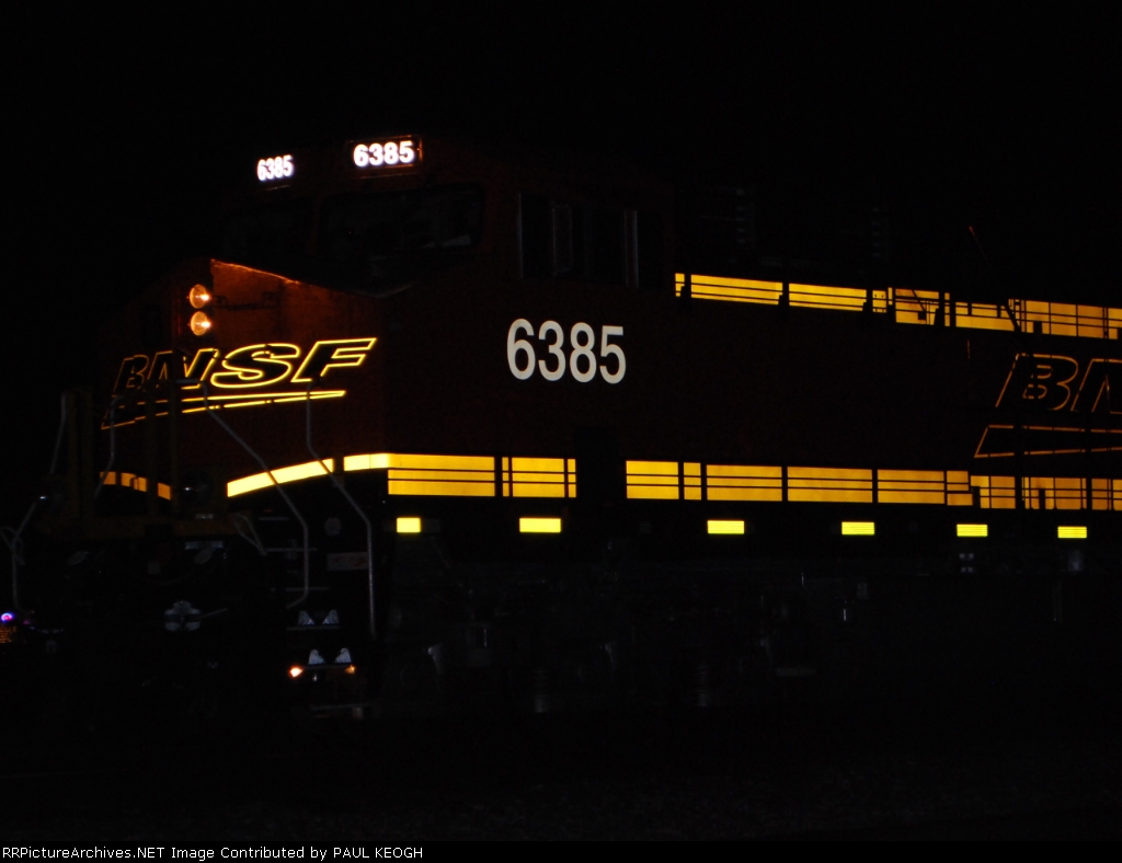 BNSF 6385 close up shot of her Swoosh logo and LED road number lights as she leads a Loaded coal ...